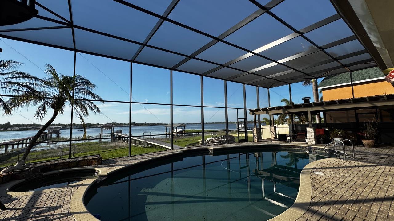 Two-Story Pool Cage with Flat Roof in Largo | Before & After Installation